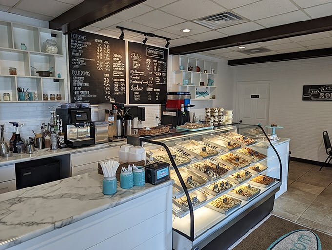 Step into cinnamon roll paradise! The display case is a treasure trove of gooey, frosted wonders that would make even Mary Berry weak in the knees.