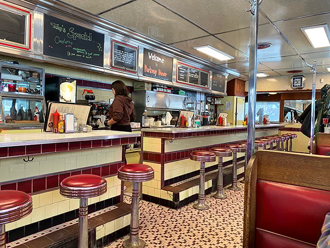 Slide into nostalgia on these cherry-red stools. The gleaming counter's like a runway for your taste buds to take flight!