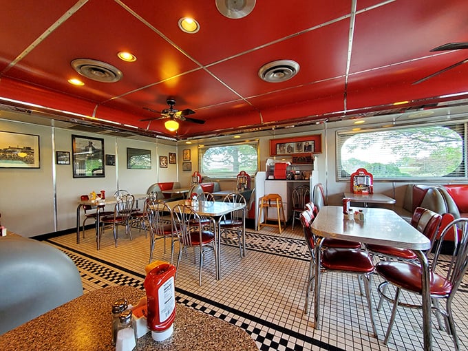 Step inside and feel the warmth wash over you &ndash; literally! The crimson ceiling and checkered floor create a cozy cocoon that's part 1950s soda fountain, part modern-day comfort zone.