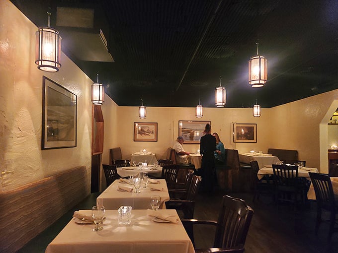 Step into a cozy cavern of culinary delights. This dining room feels like the inside of a stylish submarine &ndash; minus the periscope, plus the perfect ambiance.