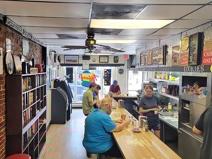 Step into a time capsule of culinary nostalgia. This cozy diner interior whispers tales of late-night chats and early morning pick-me-ups, all served with a side of small-town charm.