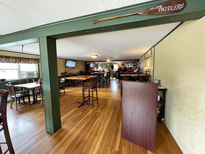 "Welcome, paddlers!" The sign says it all. This cozy interior promises comfort food that'll make you want to trade your canoe for a comfy booth.