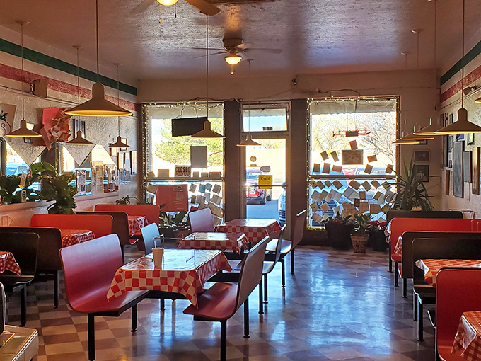 Step into a time machine of taste! Red checkered tablecloths and cozy booths set the stage for a culinary journey back to simpler, more delicious times.