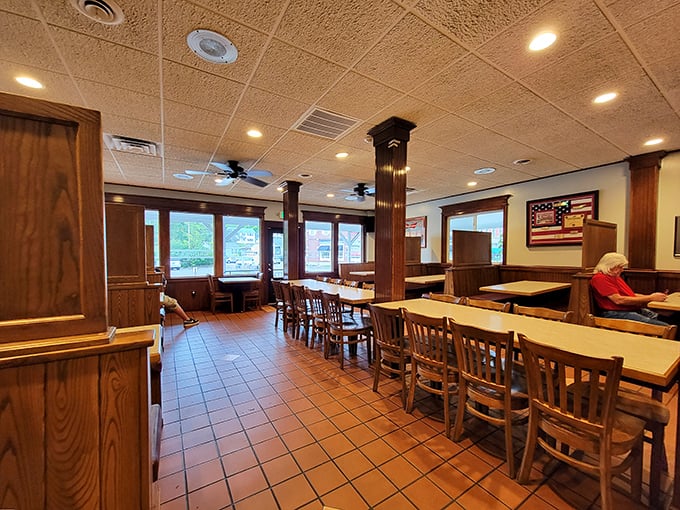 Step into a time machine disguised as a pizzeria. Wood paneling, sturdy tables, and an American flag create a cozy atmosphere that screams "comfort food ahead!"