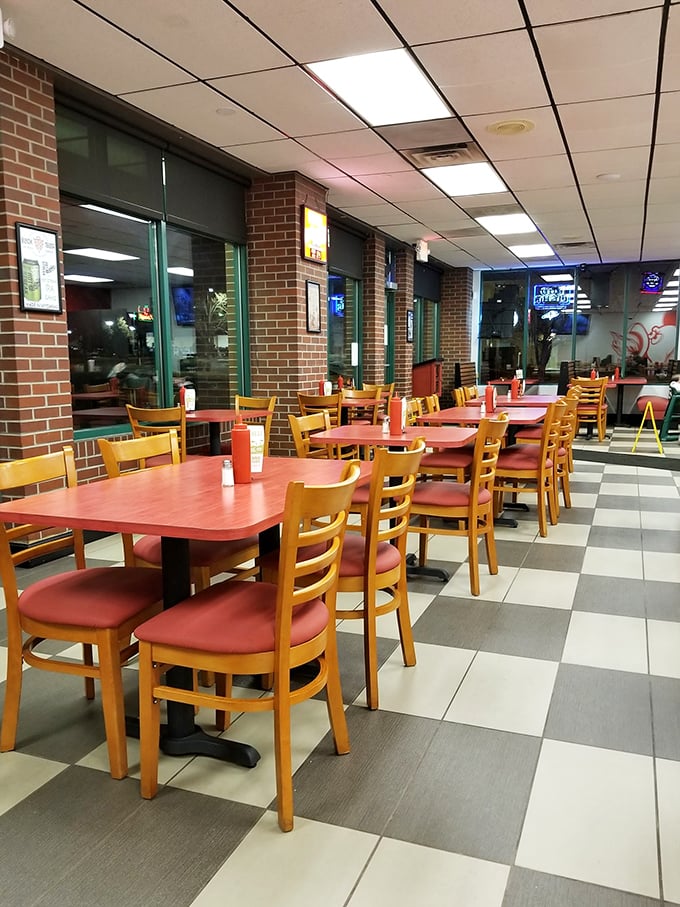 Step into a cozy wing wonderland where red tables and checkered floors set the stage for finger-licking goodness.