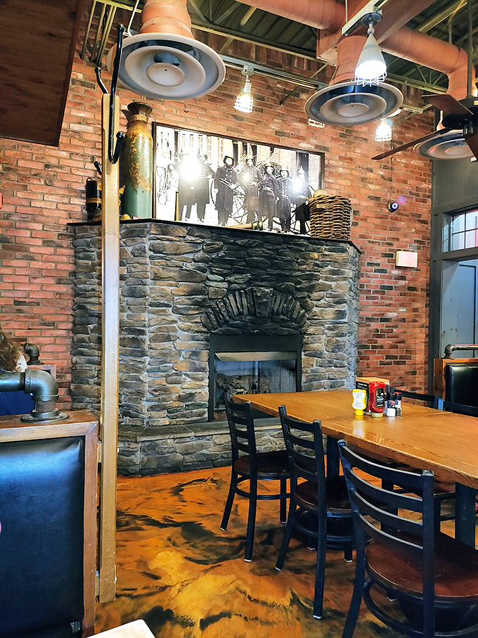 That stone fireplace isn't just for show&mdash;it's the soul of the restaurant, surrounded by exposed brick walls that whisper "stay awhile."
