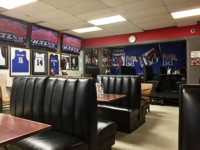 Memphis basketball memorabilia adorns the walls while black vinyl booths invite you to settle in. This is a temple of wings, not interior design.