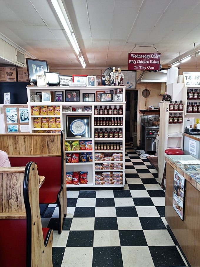 Classic black and white checkered floors lead you past wooden booths where barbecue dreams come true. That "Wednesday Only" sign is the local equivalent of winning the lottery.