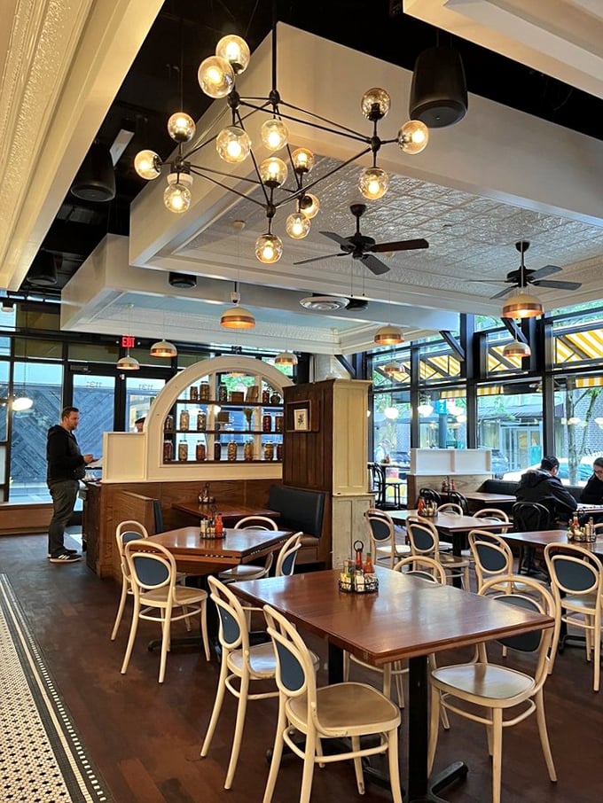 Elegant lighting fixtures and bentwood chairs create an atmosphere that says, "Yes, we're fancy enough for date night, but comfortable enough for your stretchy pants."