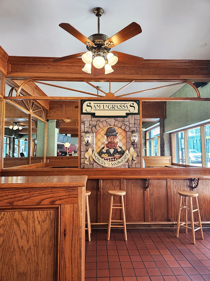 Step into sandwich heaven! This cozy interior, complete with wooden panels and ceiling fans, promises a no-frills feast for the senses.