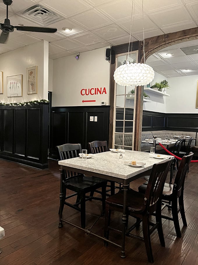 Step into a world where "Cucina" isn't just a sign &ndash; it's an invitation to indulge in comfort and class, all under a twinkling chandelier.