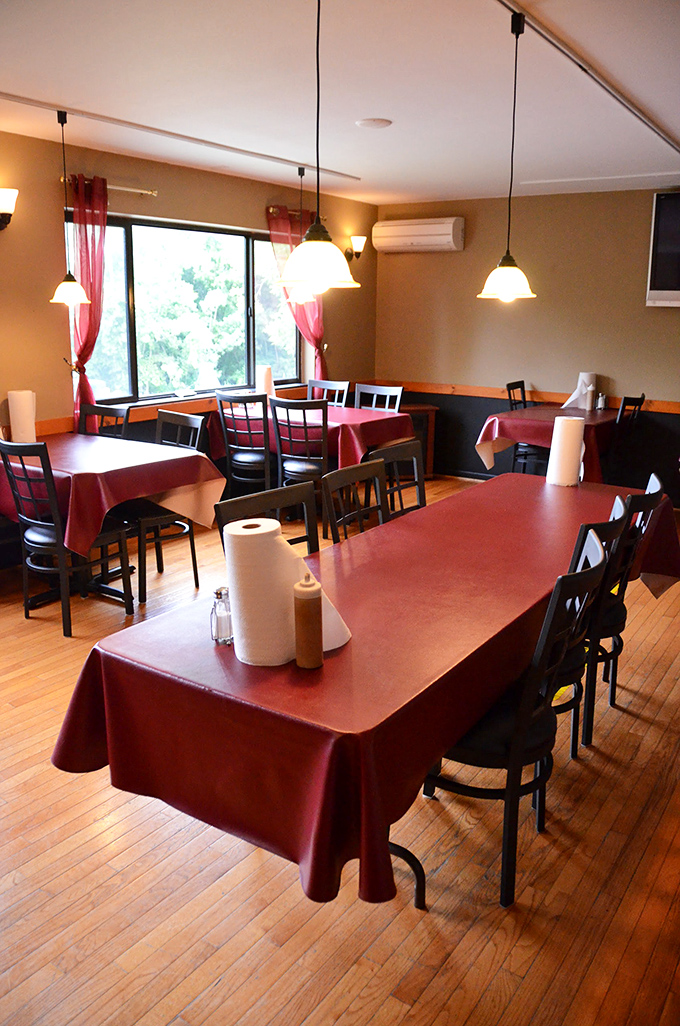 Step into a cozy time capsule. Frankie's interior whispers of countless stories shared over hearty meals. Those burgundy tablecloths have seen more drama than a soap opera marathon.