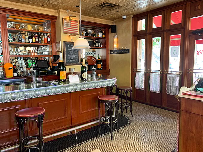 Step into a time machine disguised as a bar! Zinc Bistro's interior whisks you away to a cozy Parisian caf&eacute;, complete with vintage charm and the promise of delectable libations.
