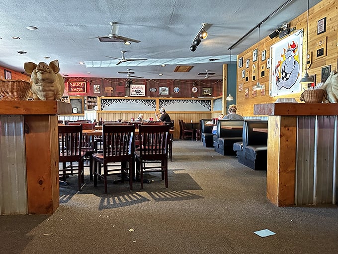 Step inside and let the aroma guide you. This rustic interior is where barbecue dreams come true, complete with quirky pig decor.