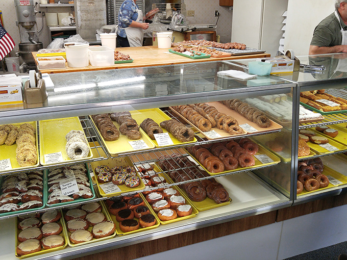 Behold the altar of fried dough! This counter is where dreams come true and diets go to die, all with a smile.