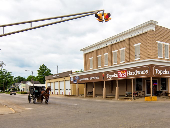 Downtown Shipshewana: where horse-drawn buggies and muscle cars coexist in perfect harmony. It's like "The Fast and the Furious" meets "Little House on the Prairie"!
