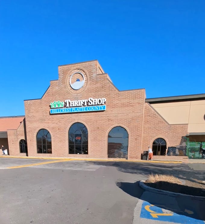 Step right up to the thrift shop extravaganza! This storefront promises treasures galore behind its welcoming arched windows.