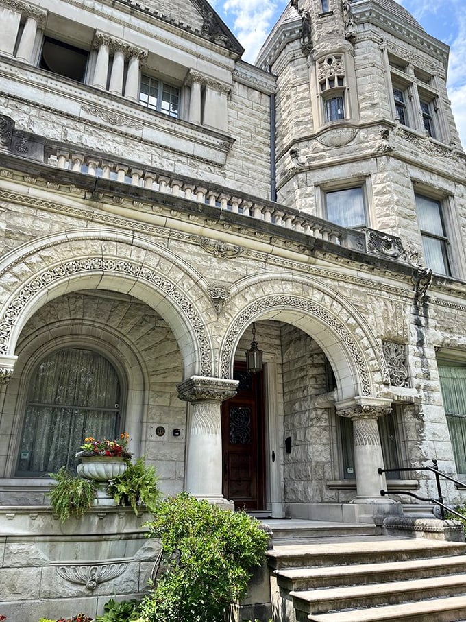 Grand arches and intricate stonework invite you in. It's like the house is saying, "Come on in, let's have a bourbon and chat about the good ol' days."