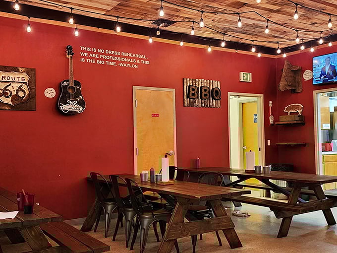 Wooden picnic tables under string lights and that Waylon Jennings quote&mdash;this isn't just dinner, it's a honky-tonk barbecue revival where sauce-stained napkins are badges of honor.