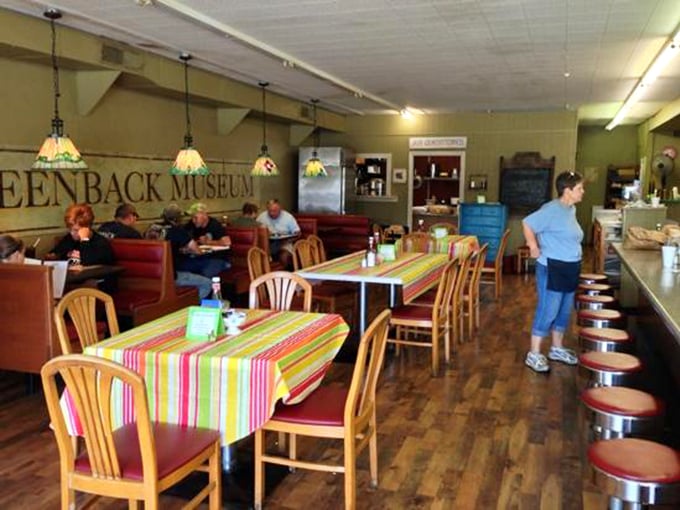 Inside, colorful tablecloths brighten wooden floors that have supported generations of hungry patrons, while Tiffany-style lamps cast a warm glow over conversations.