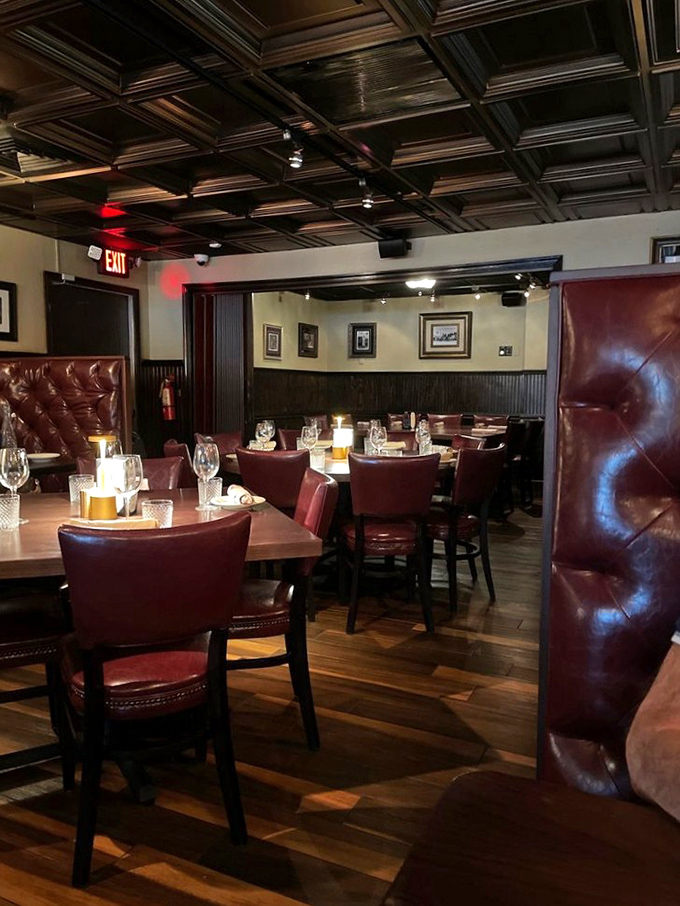 Classic steakhouse ambiance done right&mdash;burgundy leather booths, coffered ceilings, and an atmosphere that whispers, "Important conversations and exceptional steaks happen here."