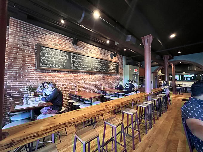 Where craft beer meets culinary artistry &ndash; Armsby Abbey's interior blends exposed brick, live-edge wood, and chalkboard menus into a space that feels like home, only better.