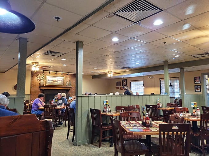 Inside, green-paneled dividers and wooden chairs create that perfect "come as you are" atmosphere where comfort trumps pretension and conversation flows as freely as the sweet tea.