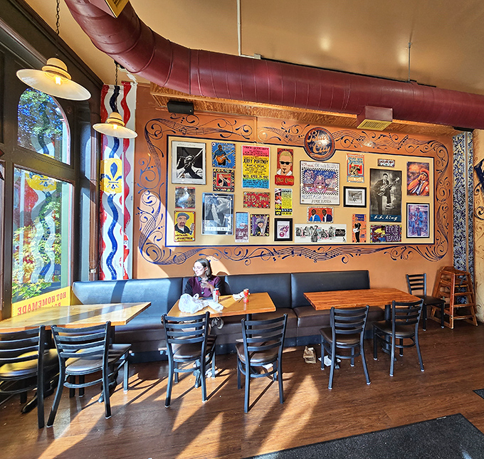 Blues harmonies for your eyes and stomach: The vibrant interior where concert posters and photographs create the perfect backdrop for sandwich perfection.