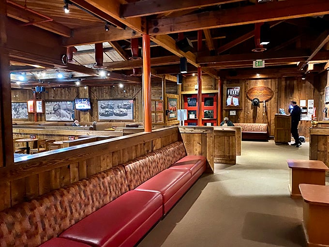 Rustic wooden beams and plush red leather booths create that perfect steakhouse atmosphere where time slows down and conversations deepen.