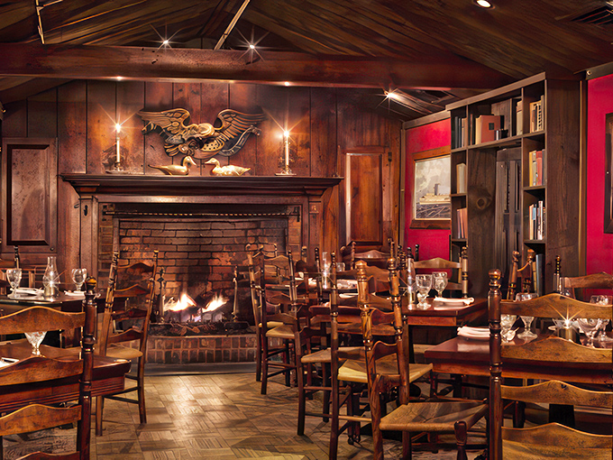 Step into a time capsule of coziness. This dining room, with its roaring fireplace and golden eagle, is where history meets comfort food heaven.