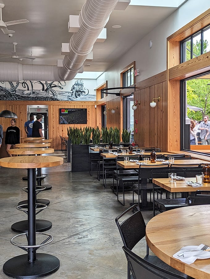 Step into a world where rustic charm meets modern flair. Chomp's interior is a feast for the eyes, with wood paneling, industrial touches, and an open kitchen that's pure culinary theater.