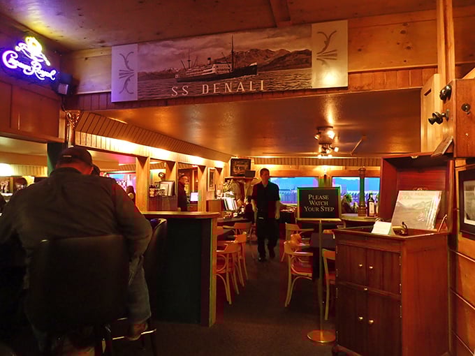 Step inside and you're transported to a world where steaks sizzle and stories flow. The SS Denali mural whispers tales of Alaskan adventures past and present.