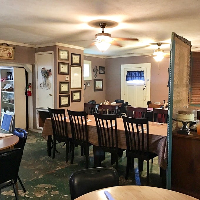 Step inside this cozy time capsule, where framed memories and mismatched chairs tell stories sweeter than the pies they serve.
