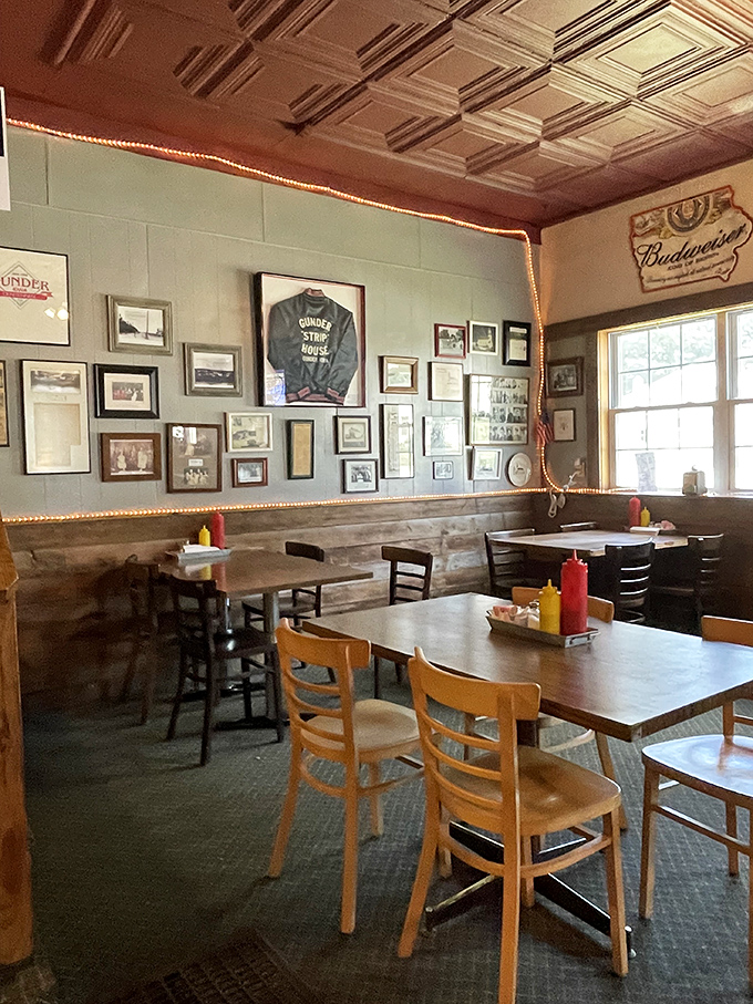 Step into a time capsule of Americana. This cozy interior whispers tales of countless satisfied diners, with memorabilia that could rival the Smithsonian's collection.