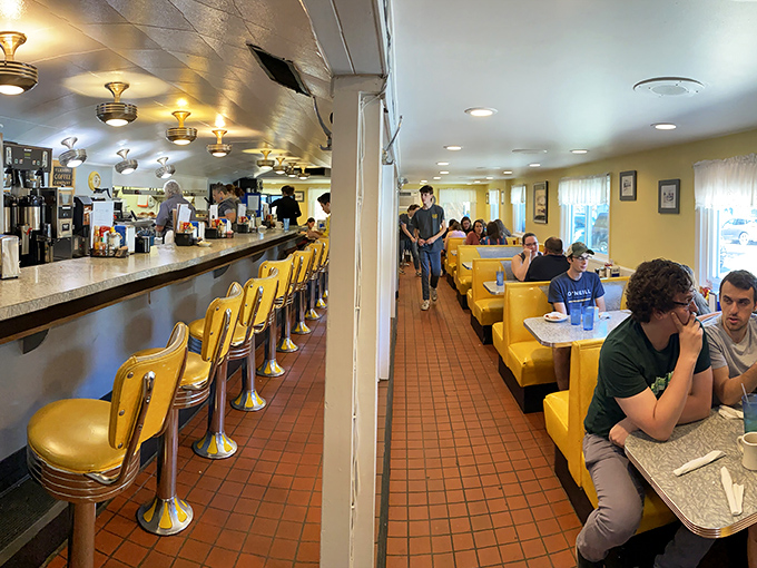 Welcome to the land of chrome and comfort! Henry's interior is a feast for the eyes, with its sunny yellow booths and counter stools that practically beg you to spin.
