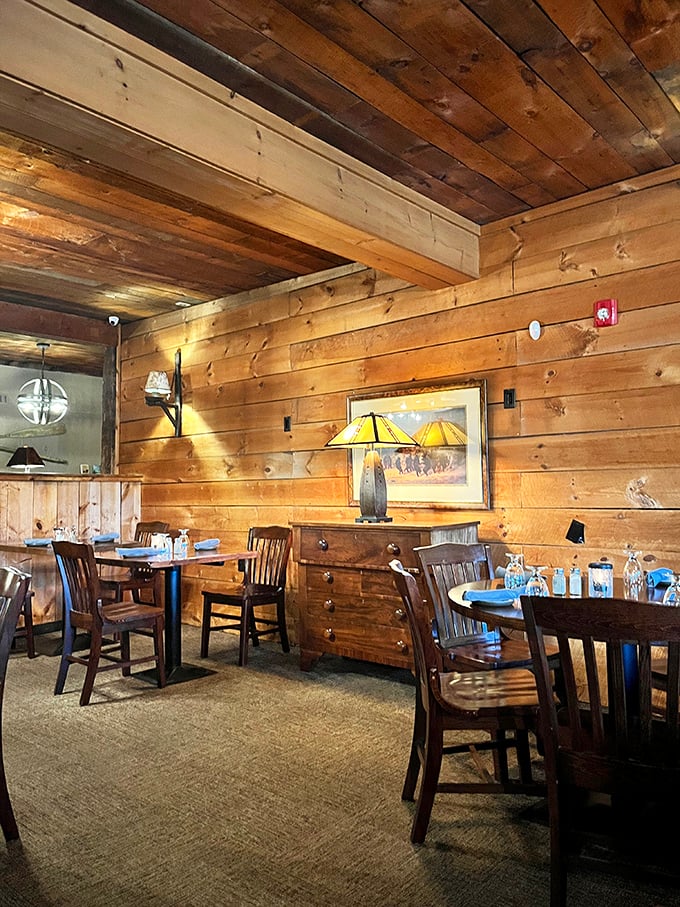 Step inside and let the warmth wash over you. This cozy interior feels like a hug from your favorite lumberjack aunt.