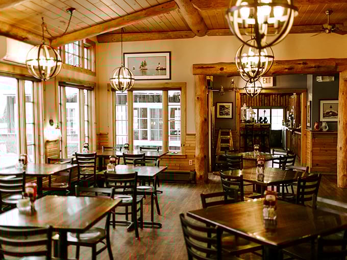 Step inside and feel the warmth! With its wooden beams and globe chandeliers, this dining room is like a bear hug for your soul.