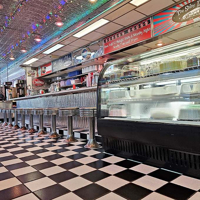 Checkered floors, chrome counters, and enough neon to light up Vegas. This isn't just a diner; it's a portal to the golden age of rock 'n' roll.