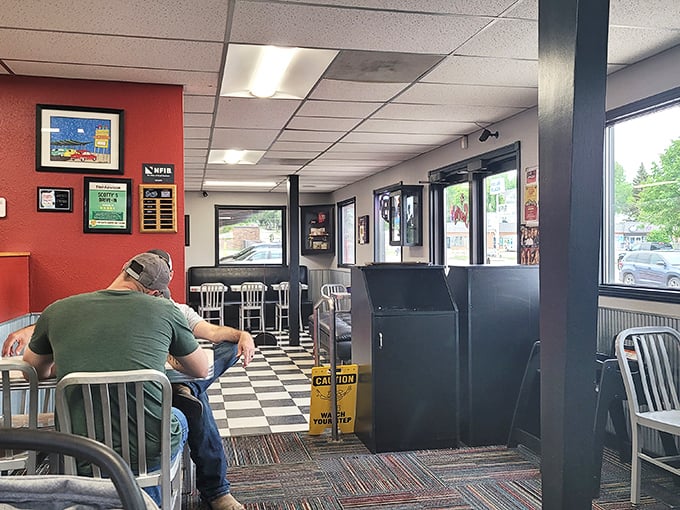Step into a time capsule of culinary nostalgia. This checkered floor has witnessed more burger-induced smiles than a 1950s sock hop.