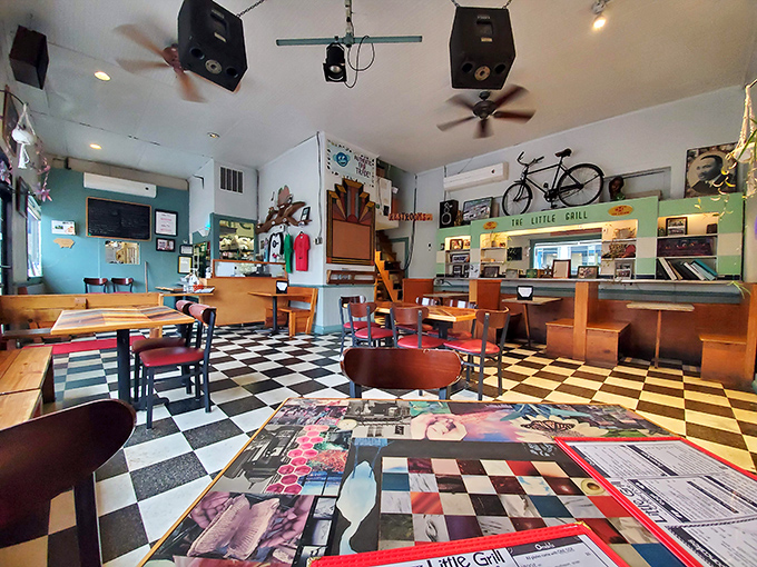 Step into a time machine of taste! This eclectic interior is where mismatched chairs and checkered floors set the stage for breakfast magic.