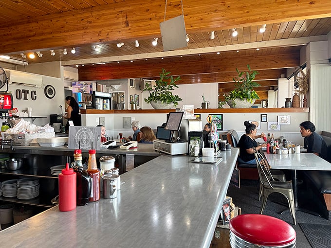 Step into a time machine of taste! The cozy interior, with its wood-paneled ceiling and retro charm, sets the stage for a memorable meal.