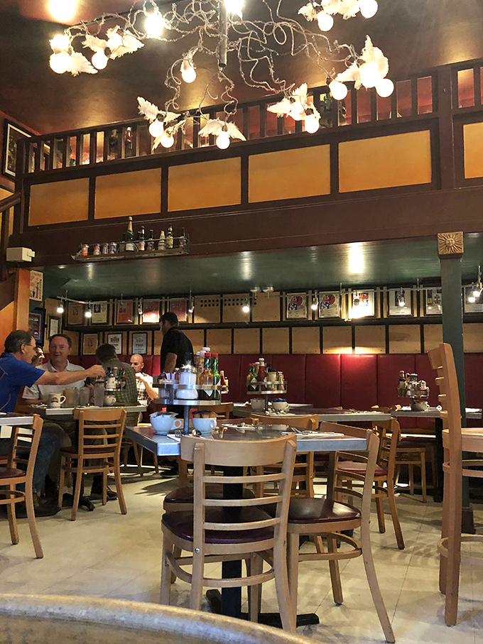 Twinkling lights and warm wood tones set the stage for a breakfast theater where pancakes are the star performers.