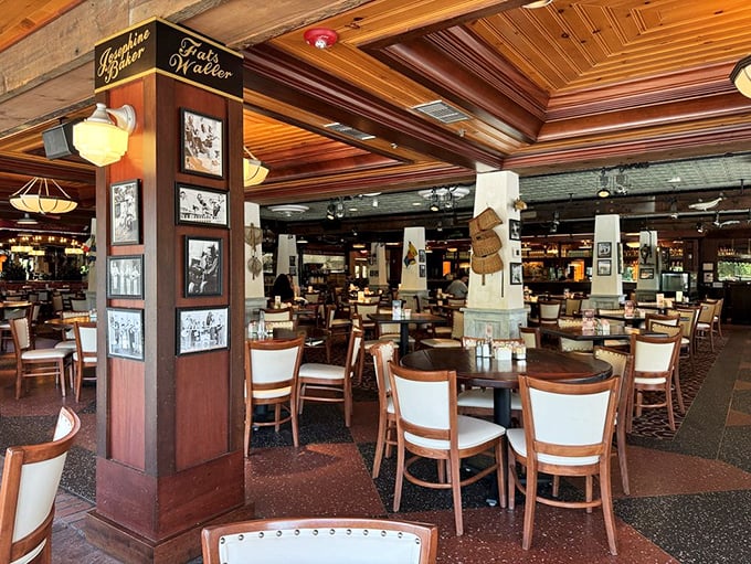 Step into a world where nautical charm meets Southern comfort. This dining room's warm wood tones and black-and-white photos tell tales of culinary adventures to come.