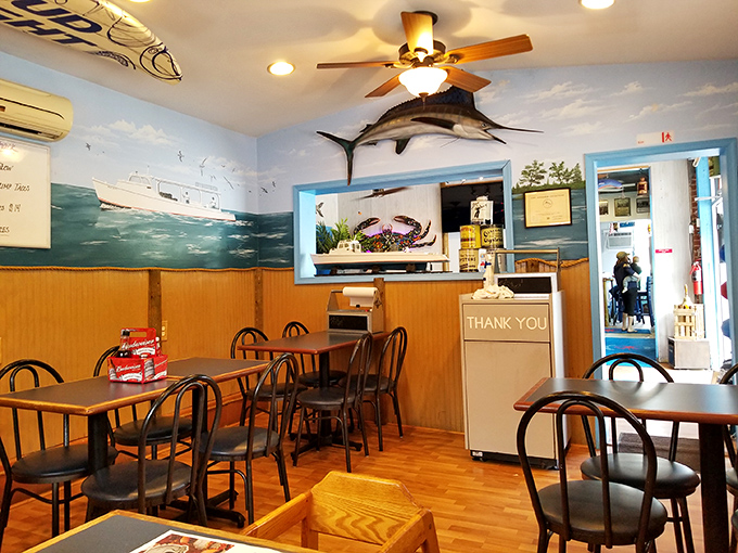 Step inside and you're transported to a cozy maritime haven. That marlin on the wall? He's the unofficial greeter, silently judging your crab-cracking technique.