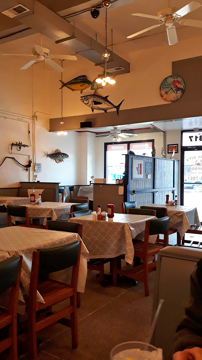 Dive into a sea of charm! Fish sculptures swim overhead in this cozy dining room, setting the perfect mood for your underwater feast.