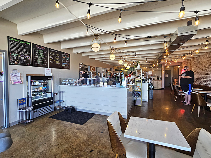 Step into donut paradise! The interior of East Park is a symphony of warm lighting, inviting aromas, and tantalizing displays. It's where calories come to dance!