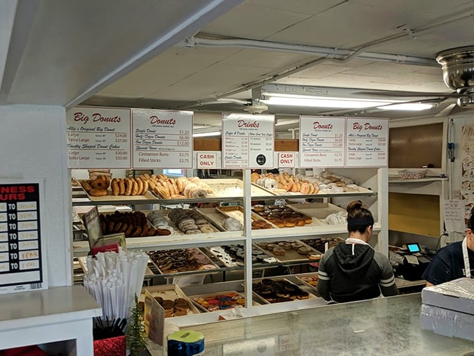 Donut heaven awaits! The display case at Allie's is a treasure trove of circular delights, each shelf a new adventure in flavor.