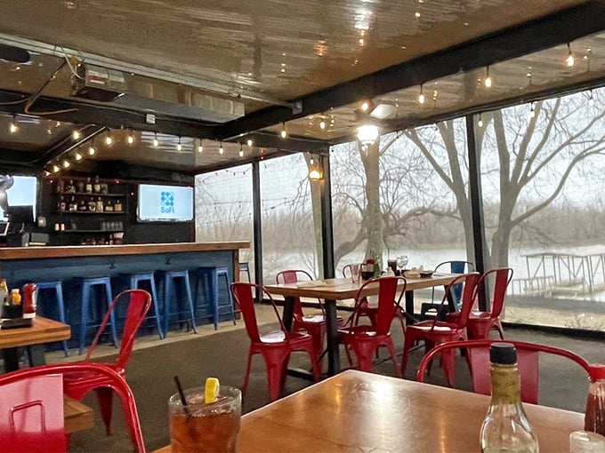 Step inside and you're transported to a cozy maritime haven. The string lights and red chairs create an ambiance that's part seaside shack, part chic bistro.