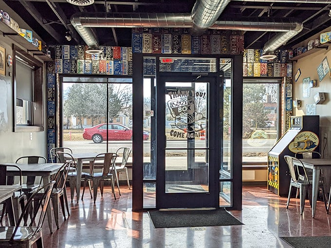 Step into a time machine of taste! The retro-modern interior, adorned with license plates and vintage signs, sets the stage for culinary nostalgia.