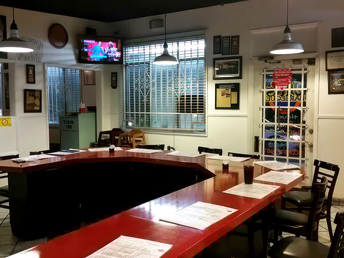 Step inside and feel the barbecue love. This cozy interior, with its red tables and memorabilia, is where smoky dreams come true.
